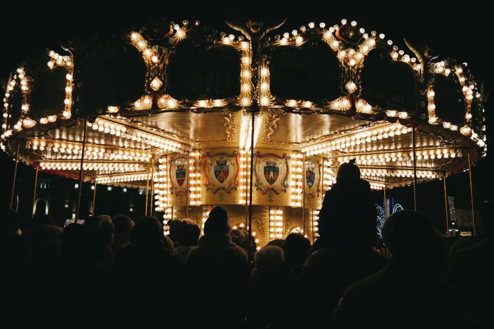 Free Stock Photo of Brightly lit carousel at night with a crowd ...