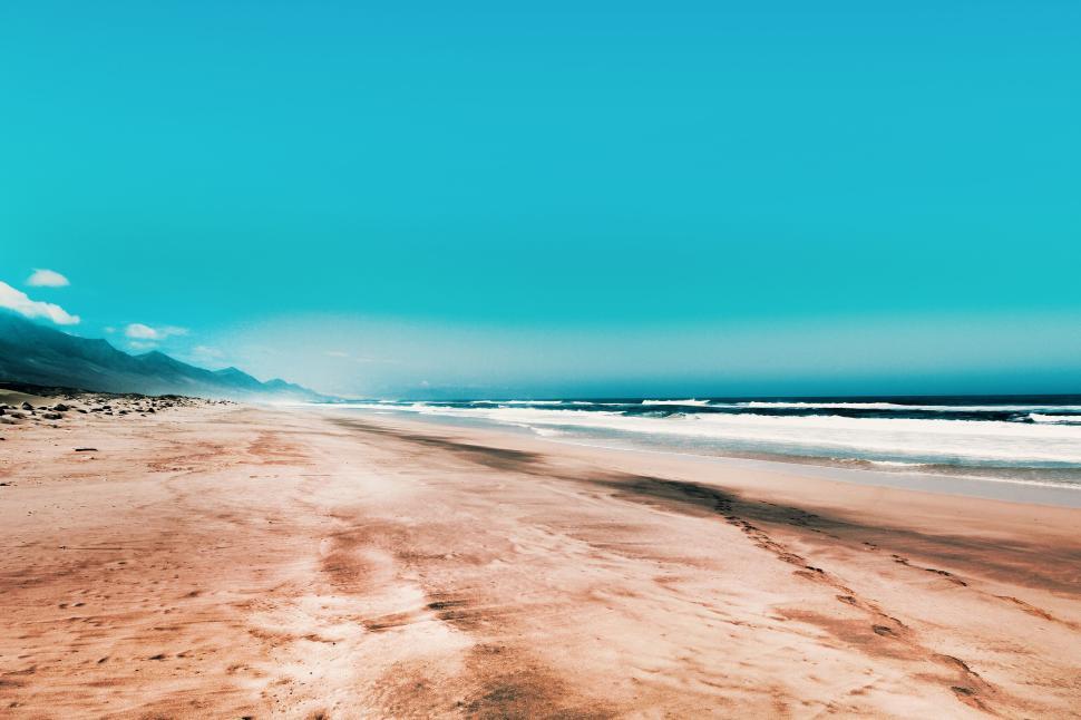 Free Stock Photo of Wide-open beach with clear sky and distant waves ...