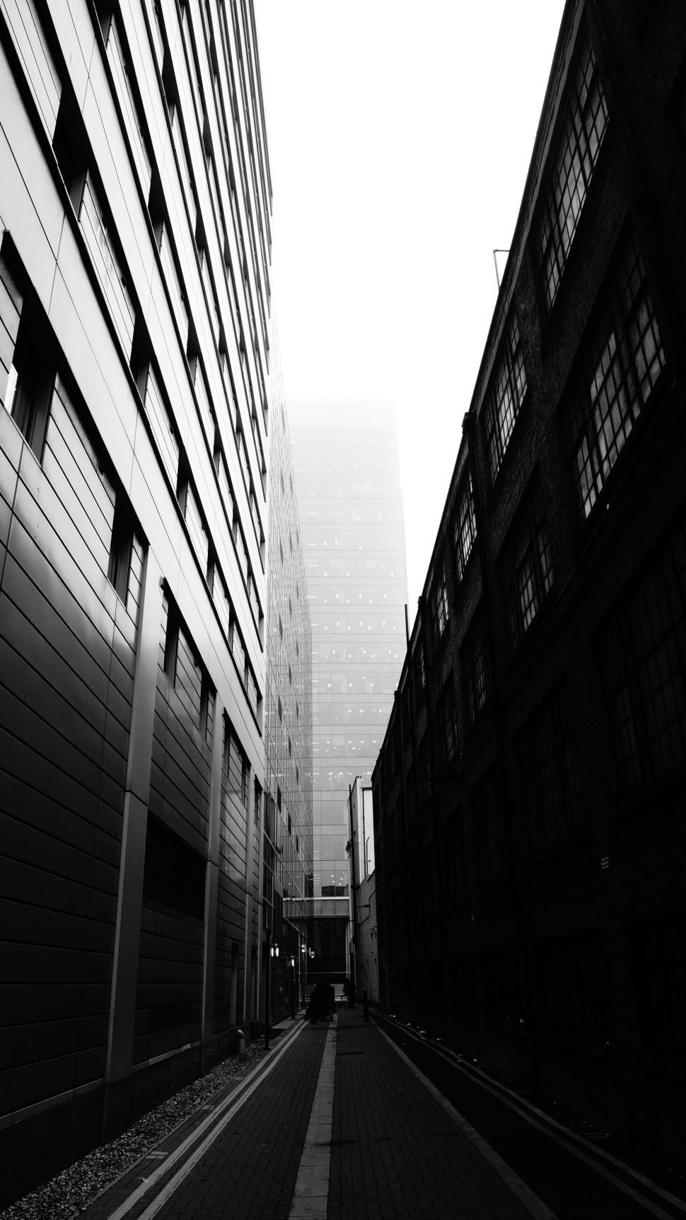 Free Stock Photo of Narrow passage between tall urban buildings in fog ...