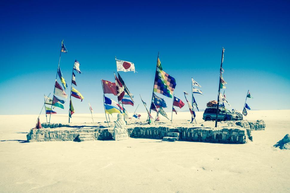 Free Stock Photo of Flags from different countries on sand flats desert ...
