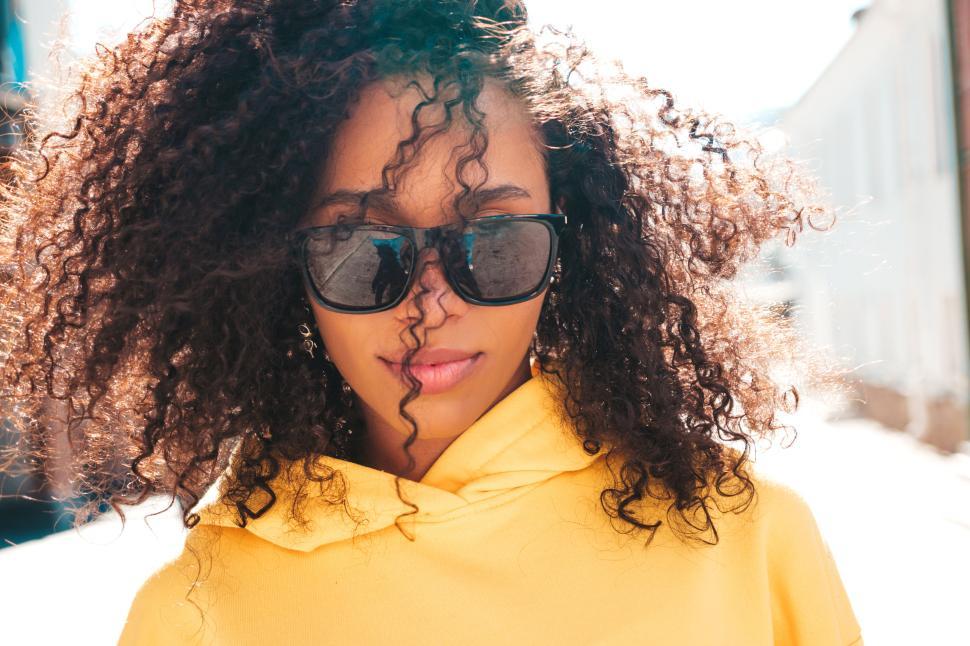 Free Stock Photo of Close-up of curly hair in bright yellow hoodie ...