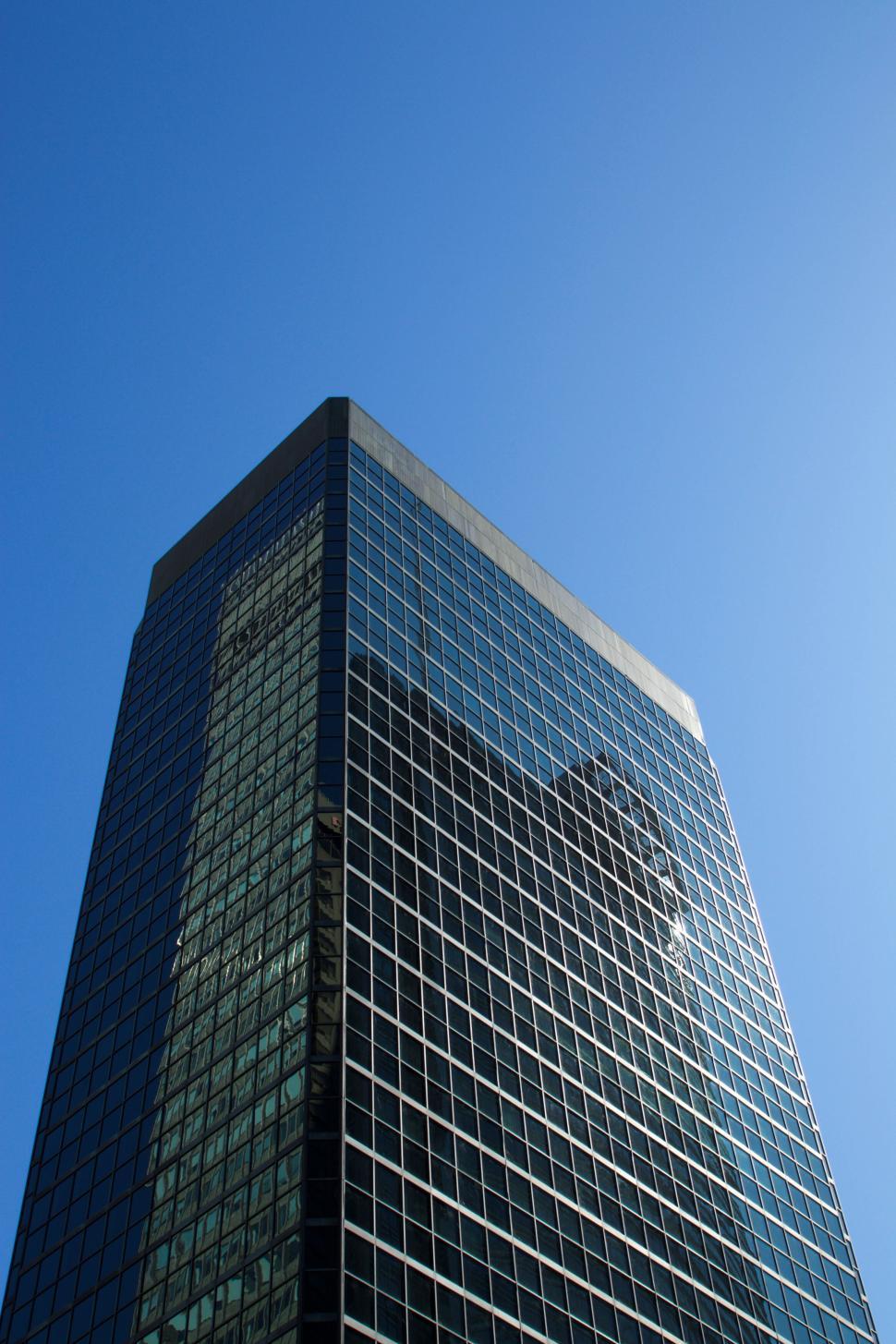 Free Stock Photo of Tall modern skyscraper against a clear blue sky ...