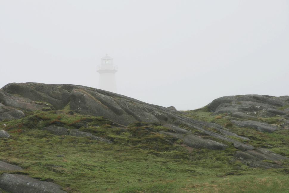 Free Stock Photo of Lighthouse in the distance partially hidden by ...