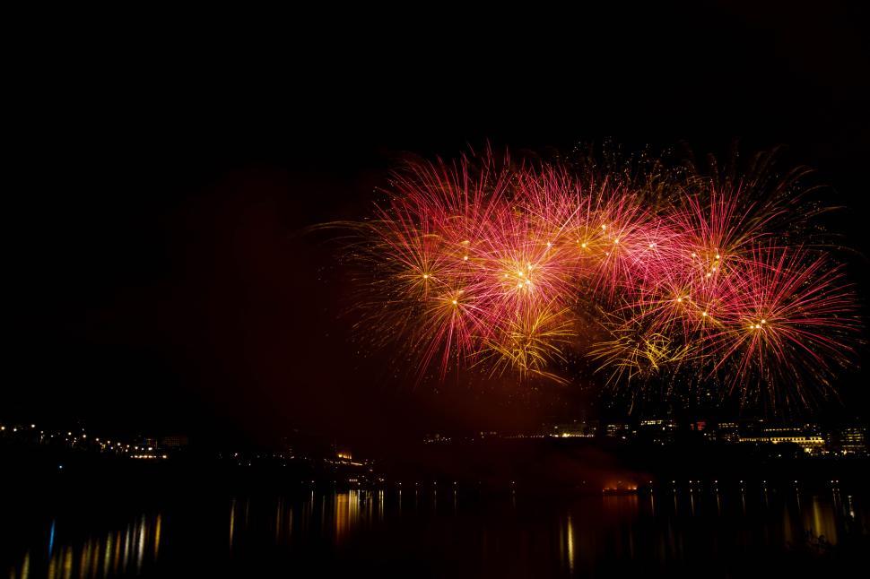 Free Stock Photo of Bright colorful fireworks display over calm night ...