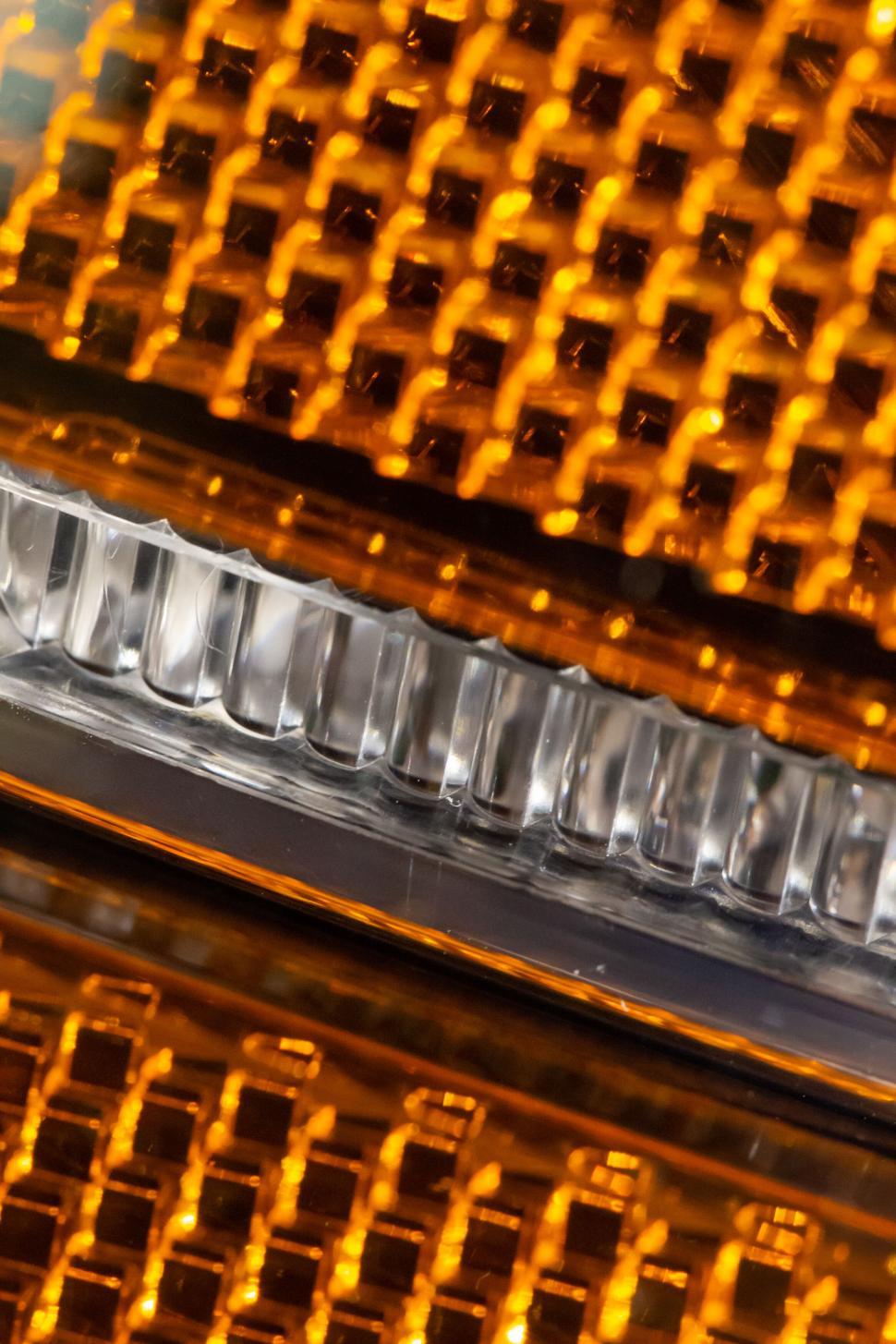 Free Stock Photo of Patterned orange car headlight close-up, intricate ...