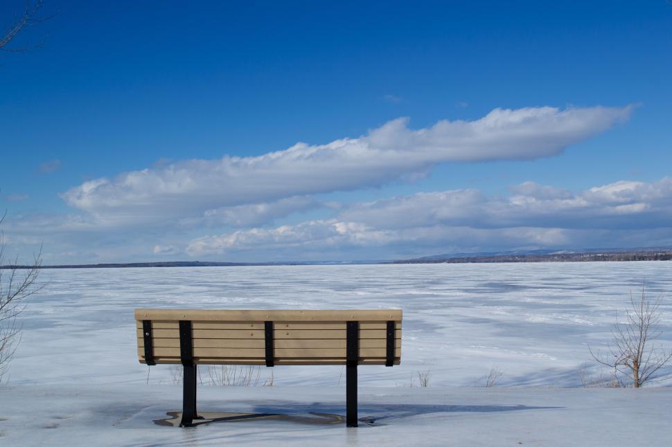 Free Stock Photo of Lonely bench facing a vast frozen lake under blue ...
