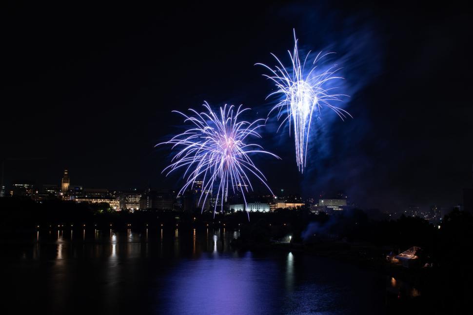 Free Stock Photo of Blue fireworks exploding over the city at night ...