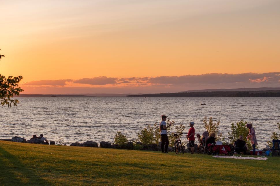 Free Stock Photo of Sunset picnic by the lake with people enjoying the ...