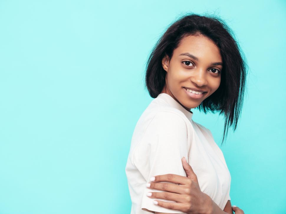 Free Stock Photo of Woman smiling blue background, casual white shirt ...
