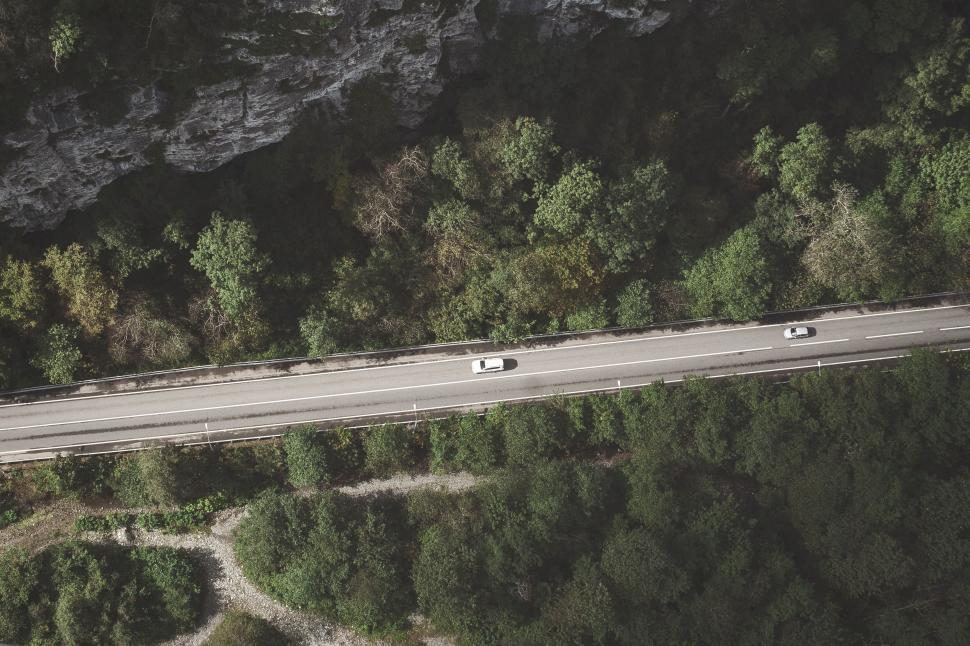 Free Stock Photo of Aerial view of cars on a road through forest ...