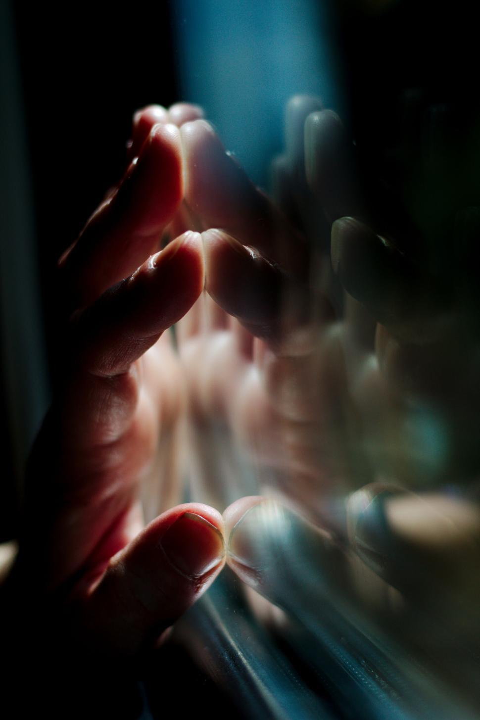 Free Stock Photo of A hand touching a reflective surface with light ...