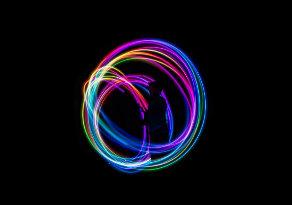 Free Stock Photo of Vibrant neon light trails forming artistic circular patterns. | Download ...