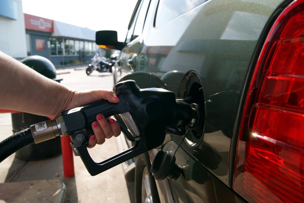 Free Stock Photo of Person Pumping Gas Into Car at Gas Station ...