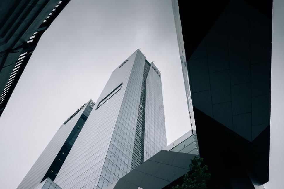 Free Stock Photo of Tall skyscrapers under a cloudy sky from below ...