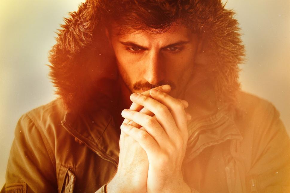 Free Stock Photo of Pensive man in fur-lined jacket with hands together ...