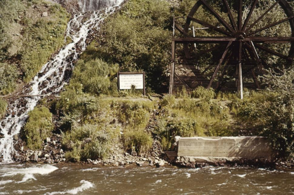 Free Stock Photo of Waterfall and old wheel structure by flowing river ...