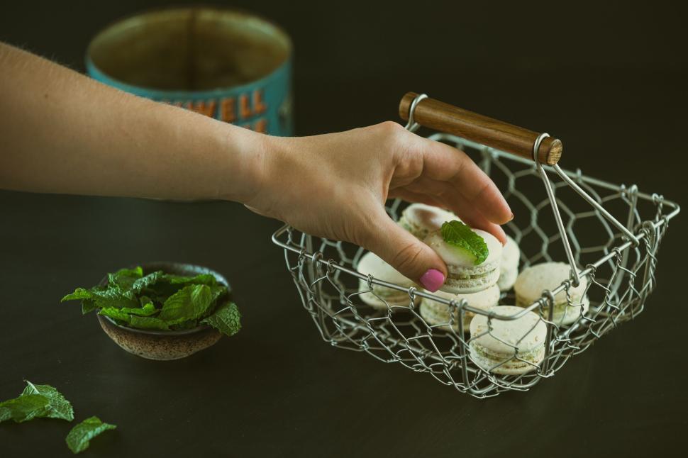 Free Stock Photo of Hand reaching for a basket of macarons | Download ...