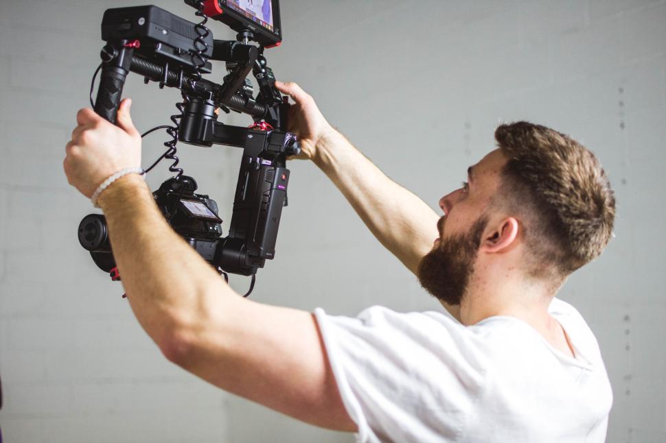 Free Stock Photo of Videographer Operating Gimbal Camera Equipment ...