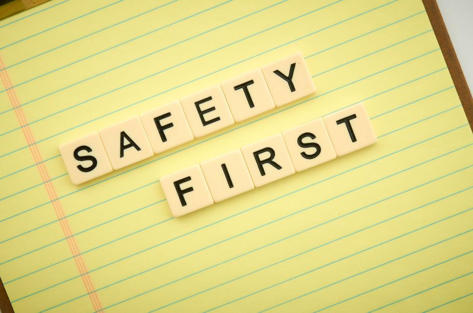 Free Stock Photo of Safety First spelled out with tiles on a yellow ...