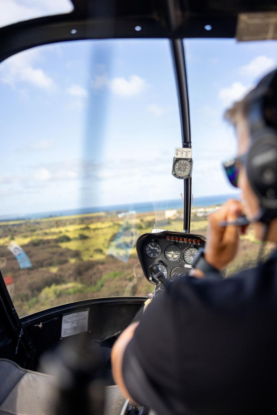 Free Stock Photo of Pilot inside helicopter cockpit flying over ...
