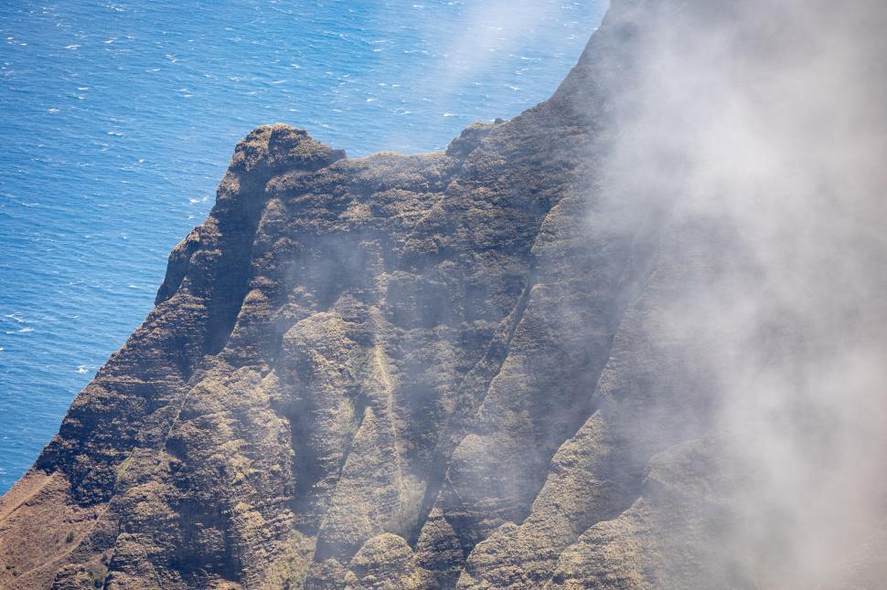 Free Stock Photo of Rocky cliffside with misty atmosphere overlooking ...