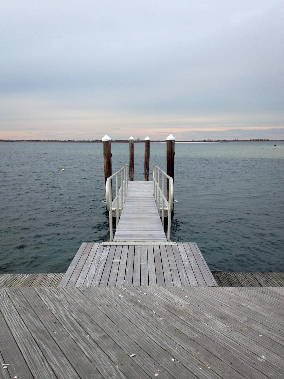 Free Stock Photo of Empty dock stretching into calm expansive water ...