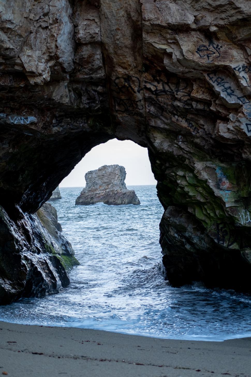 Free Stock Photo of Rocky ocean cave with a view of sea stack and water ...