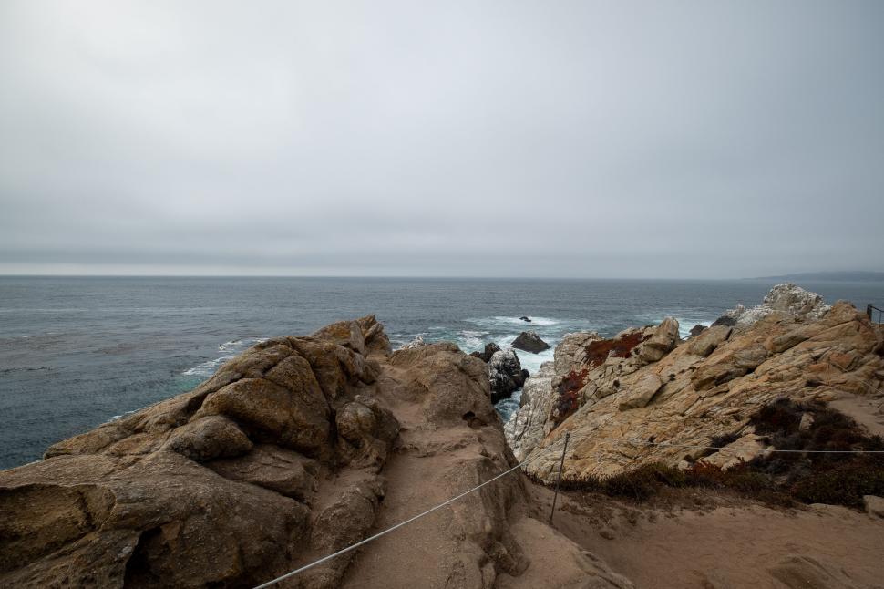 Free Stock Photo of Rocky coastal path leading to a serene ocean view ...