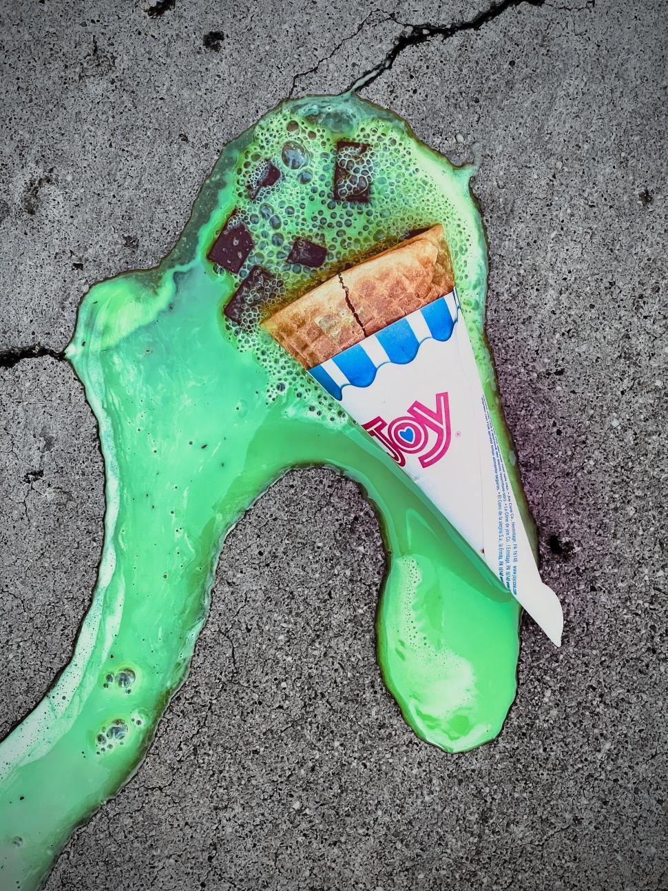 Free Stock Photo of Melting ice cream cone spills vibrant green mint ...