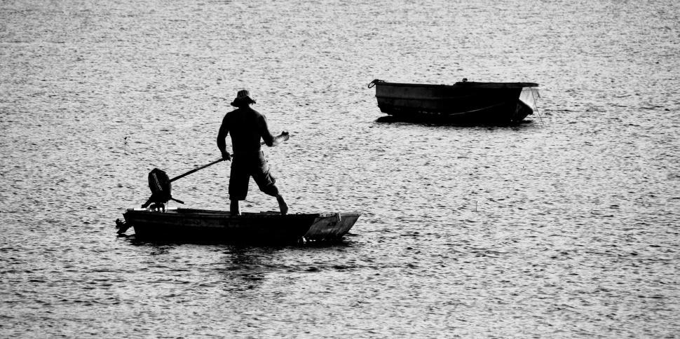 Free Stock Photo of Man rowing boat on a peaceful lake in black and ...