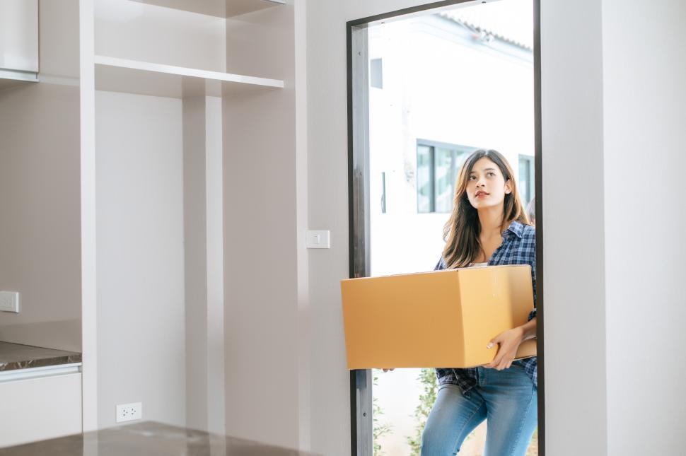 Free Stock Photo of Young woman carry large package walk into new house ...