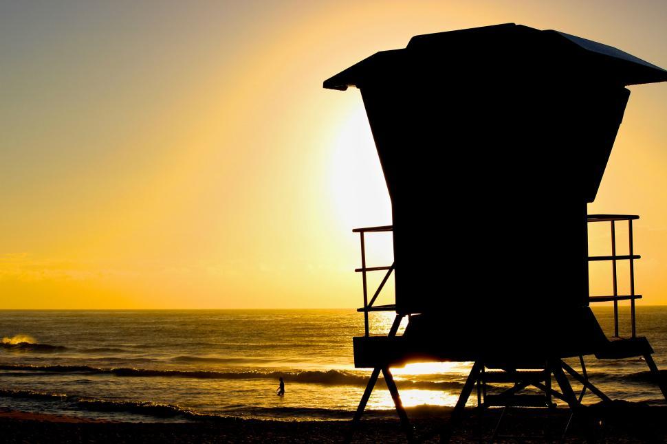 Free Stock Photo of Lifeguard tower silhouetted against a golden sunset ...