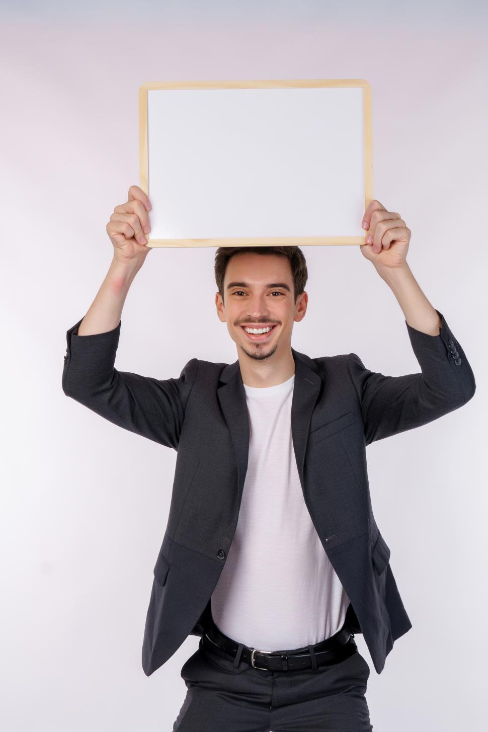 Free Stock Photo of Portrait of happy businessman showing blank ...