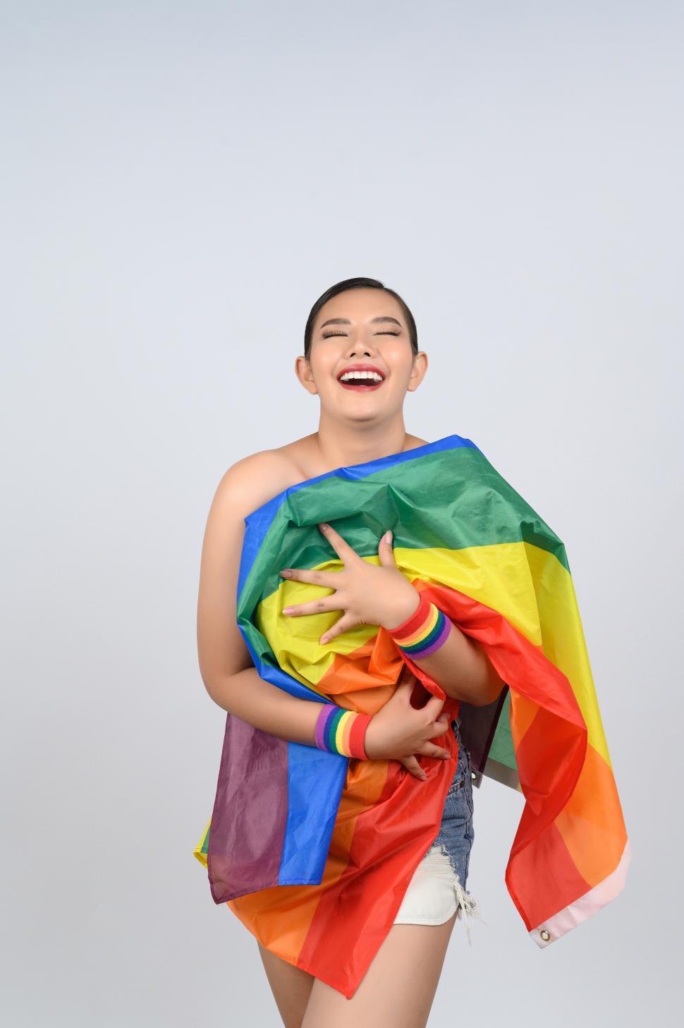 Free Stock Photo of Woman poses with crumpled gay pride flag | Download ...
