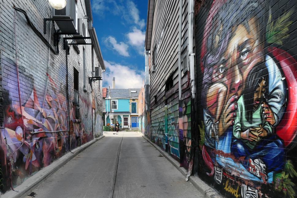 Free Stock Photo of Vibrant street art along an urban alleyway in a ...