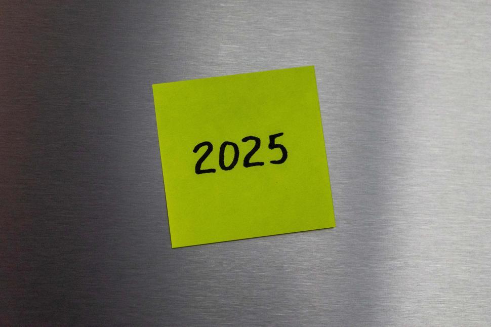 Free Stock Photo of Green sticky note with 2025 written on metallic ...