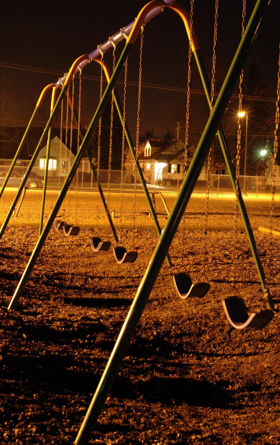 Free Stock Photo of A Row of Swings in a Park at Night | Download Free ...