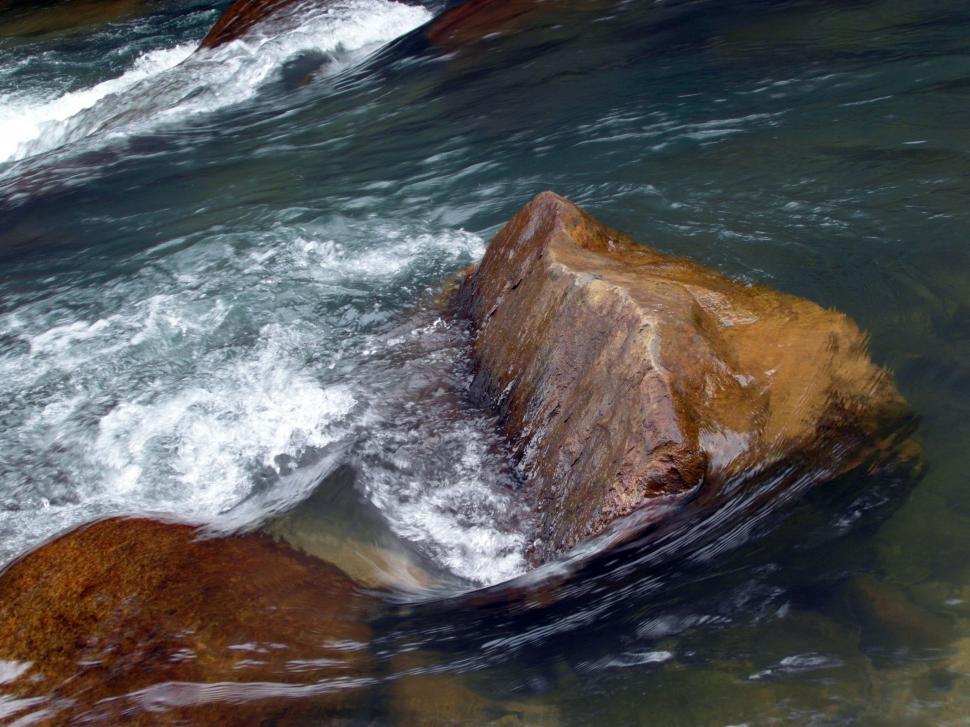 Free Stock Photo of Water rushing by smooth boulders in a river ...