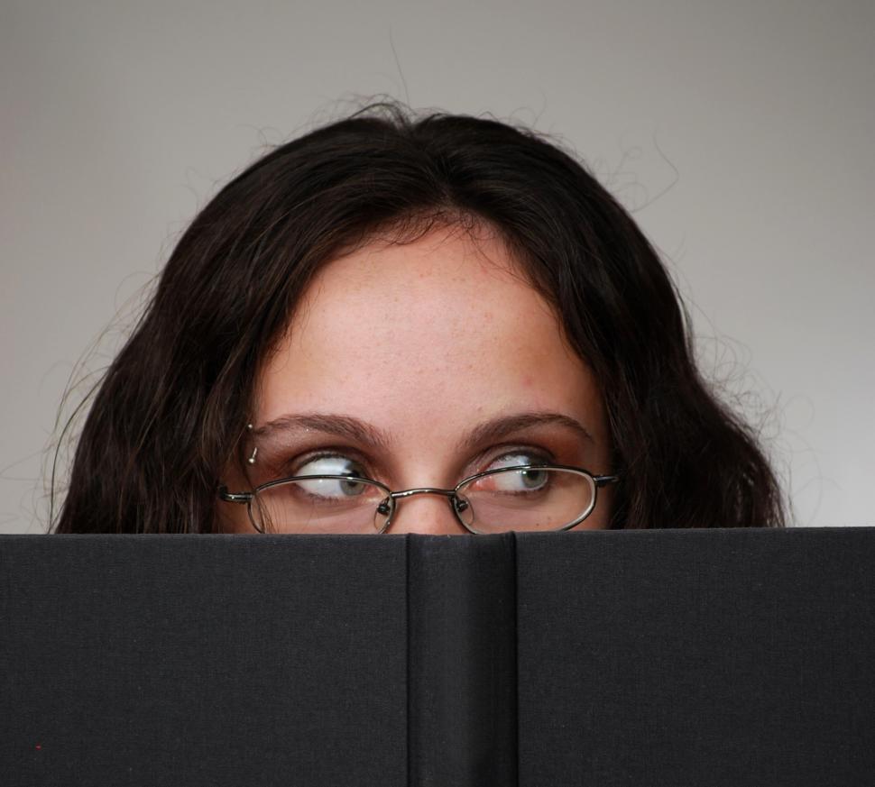 Free Stock Photo of A beautiful business woman looking over a book ...