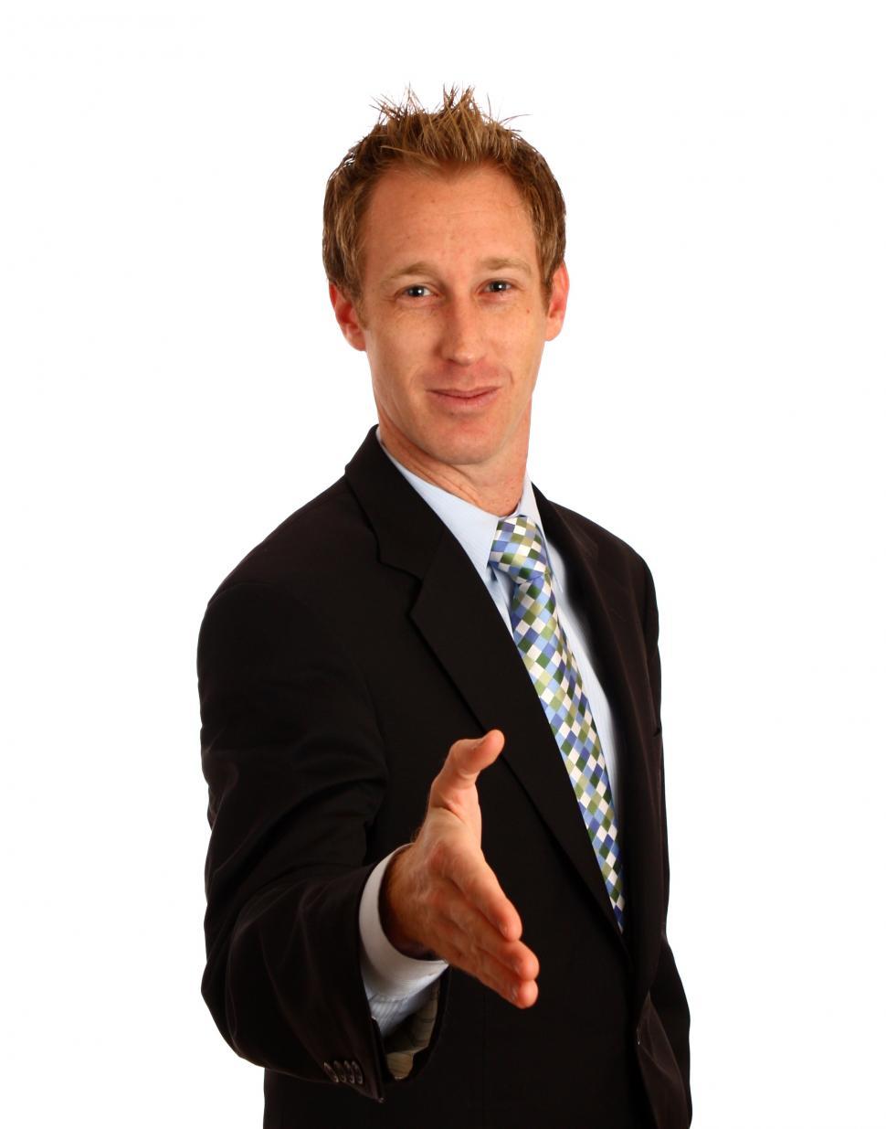 Free Stock Photo of A young businessman extending his hand for a ...