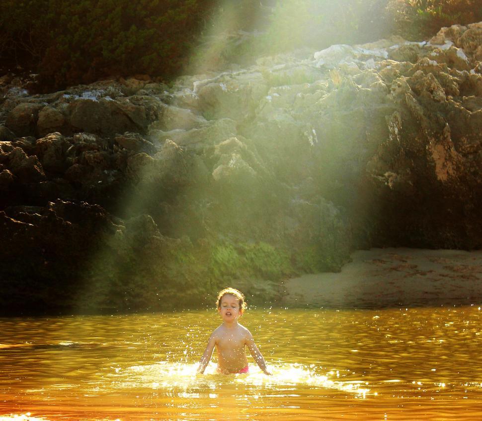 Free Stock Photo of Child hit by sun rays bathing in golden water ...
