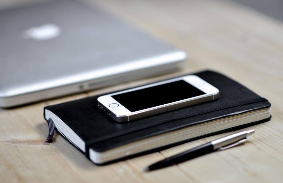 Free Stock Photo of Mobile phone on a notebook | Download Free Images ...