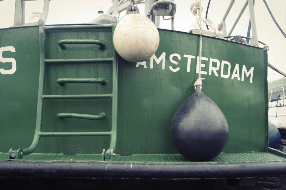 Free Stock Photo of Large Green Boat With Life Preserver on Top ...