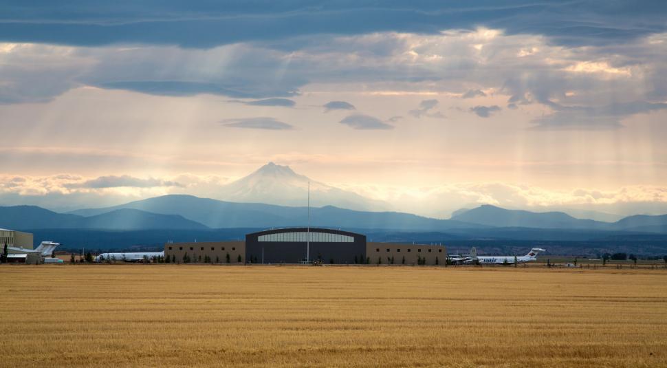 Free Stock Photo of Large Field of Grass With a Building in the ...
