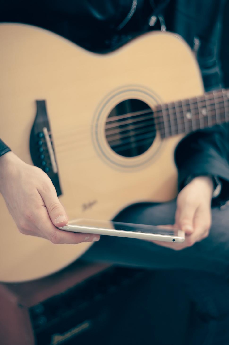 Free Stock Photo of Person Holding Cell Phone and Guitar | Download ...