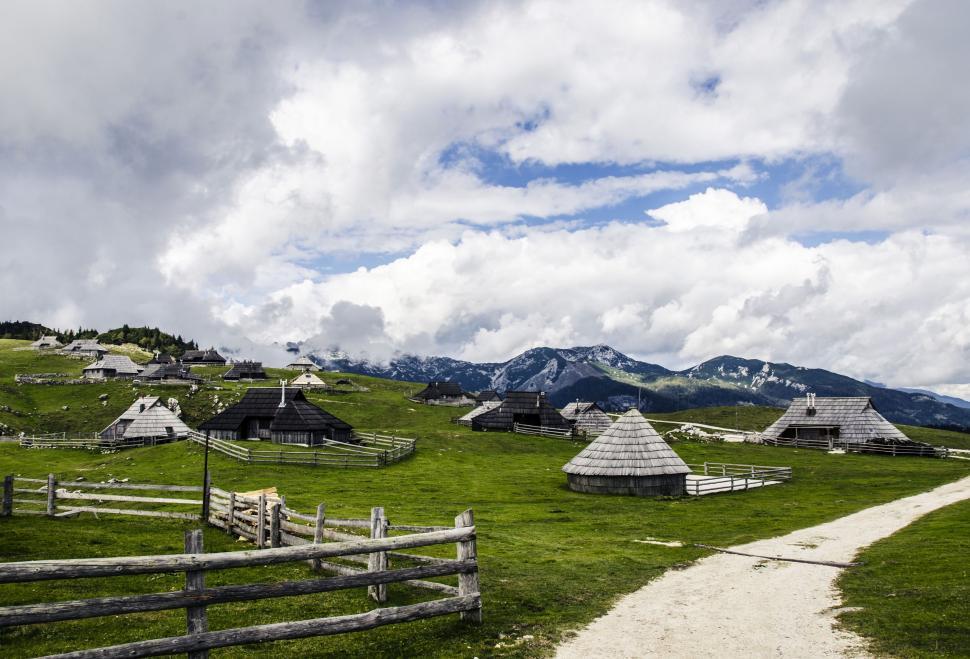 Free Stock Photo of Path Leading to Small Village Through Grassy Field ...