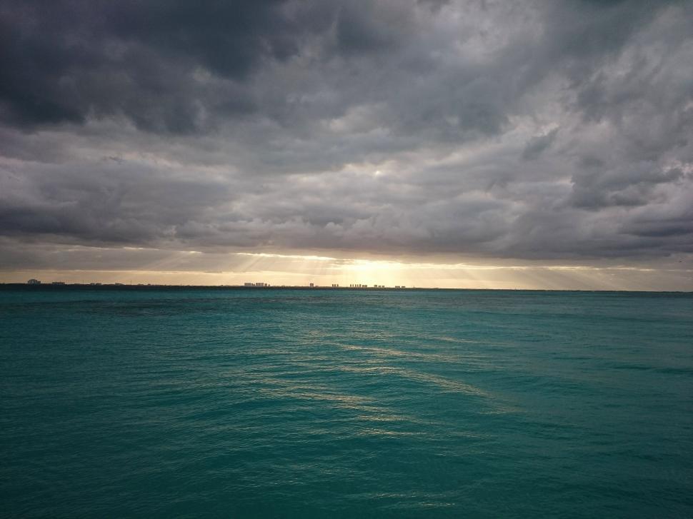 Free Stock Photo of Cloudy Sky Over Large Body of Water | Download Free ...