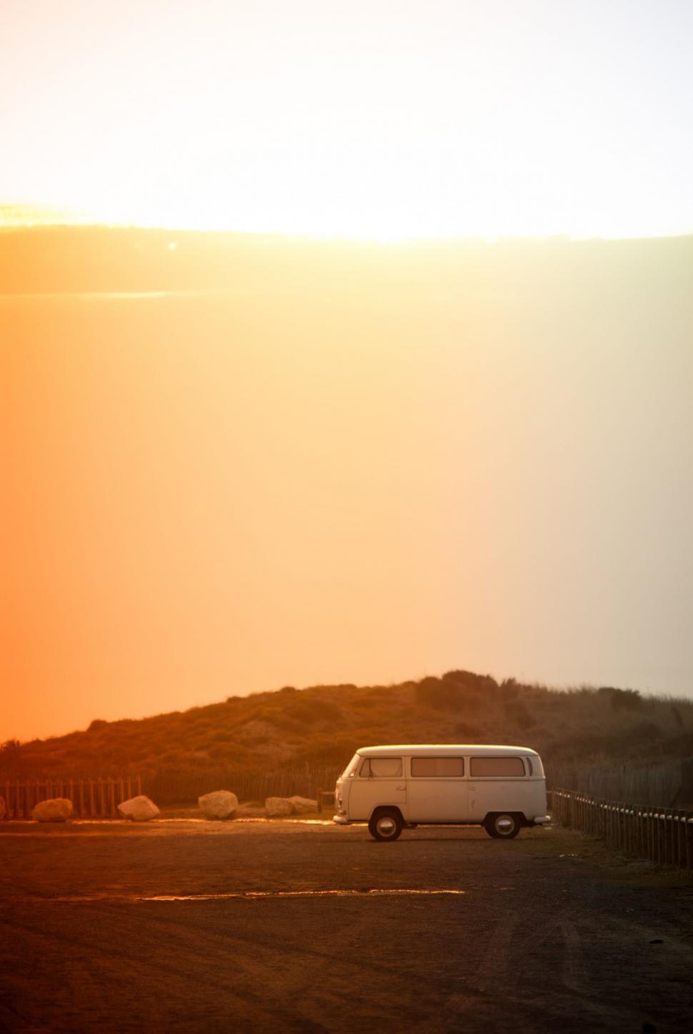 Free Stock Photo of White Van Driving Down Road Alongside Hill ...