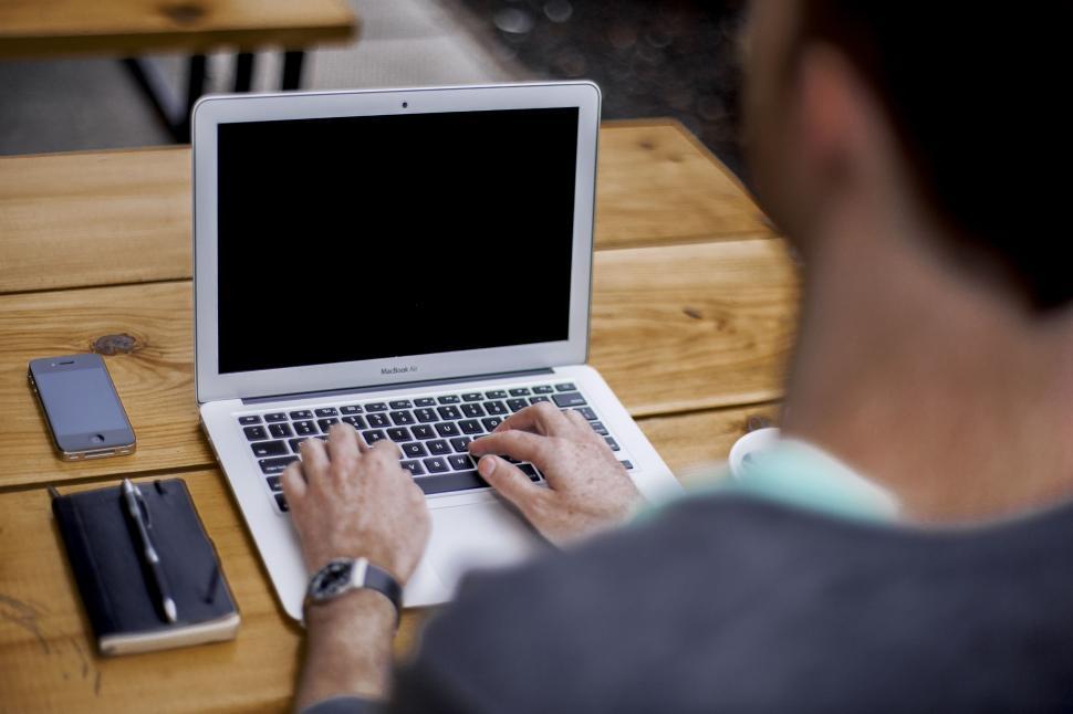 Free Stock Photo of Man Sitting at Table Using Laptop Computer ...