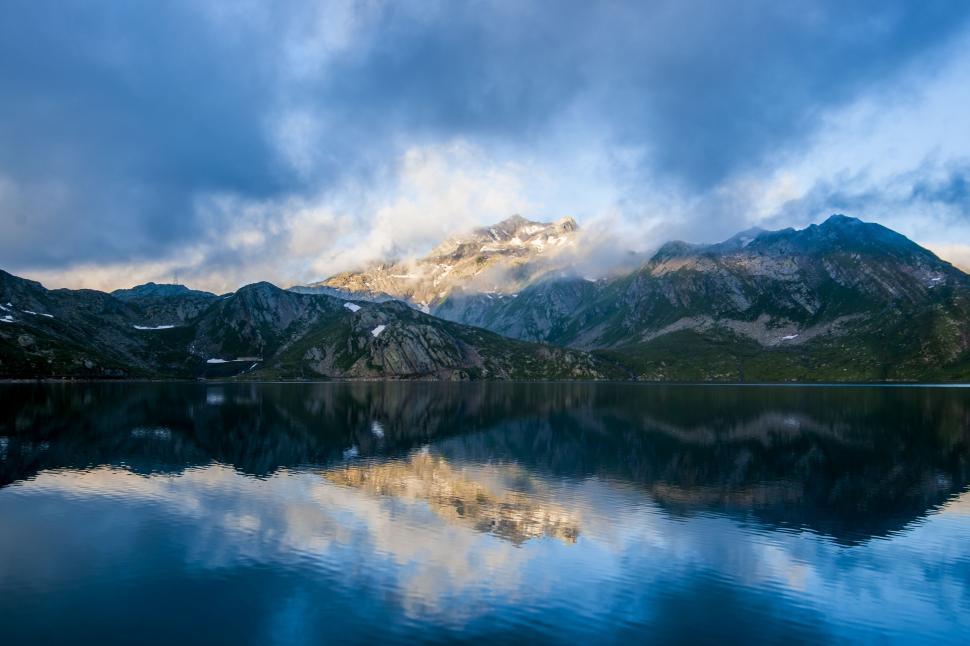 Free Stock Photo of Majestic Lake Surrounded by Towering Mountains ...